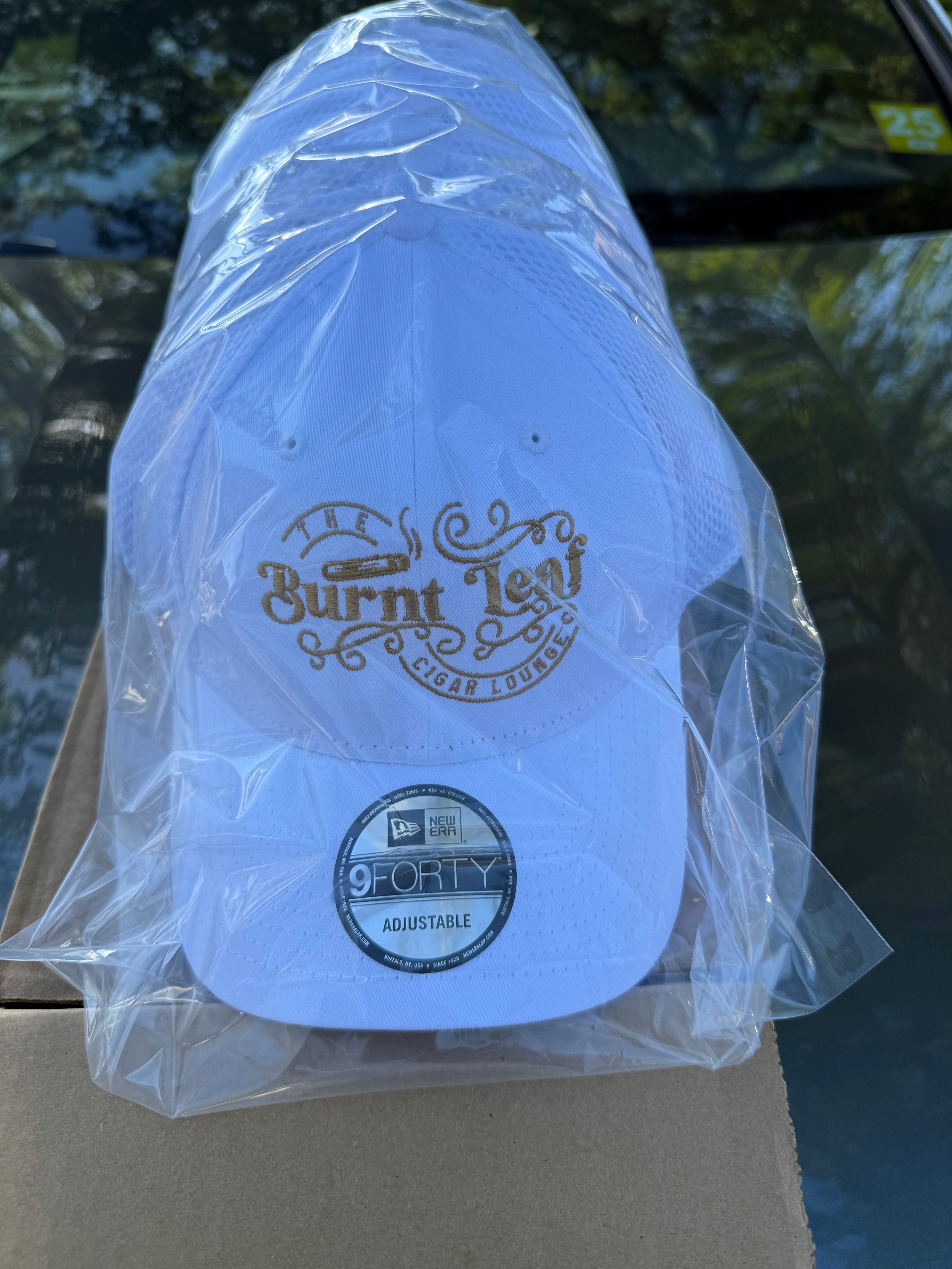 NEW ERA WHITE BRUNT LEAF TRUCKER HAT – The Burnt Leaf Lounge